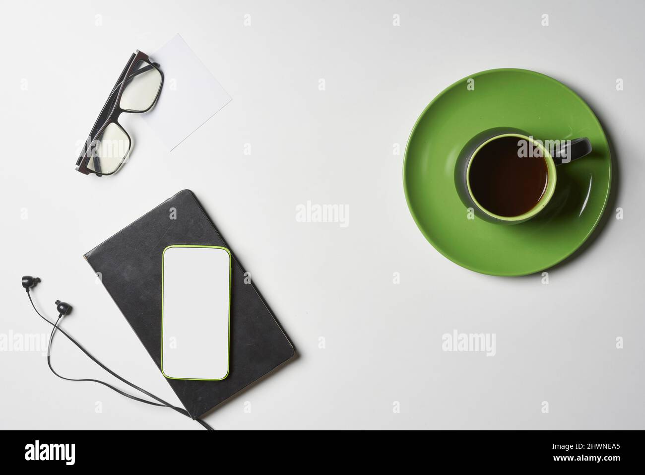 Bright office workspace. Work space with notepad, keyboard, coffee and ...