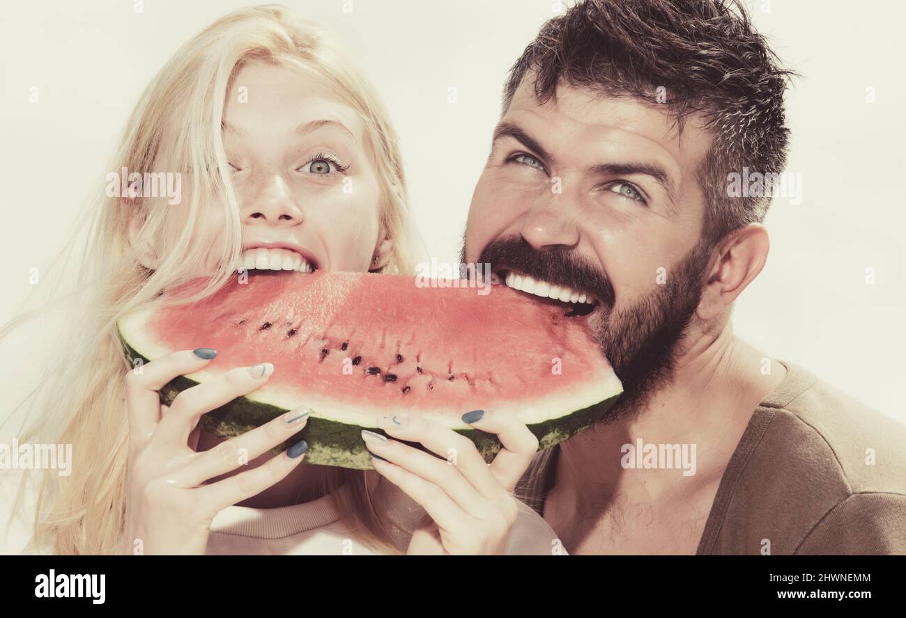 Funny couple laughing with a white perfect smile and looking each other ...