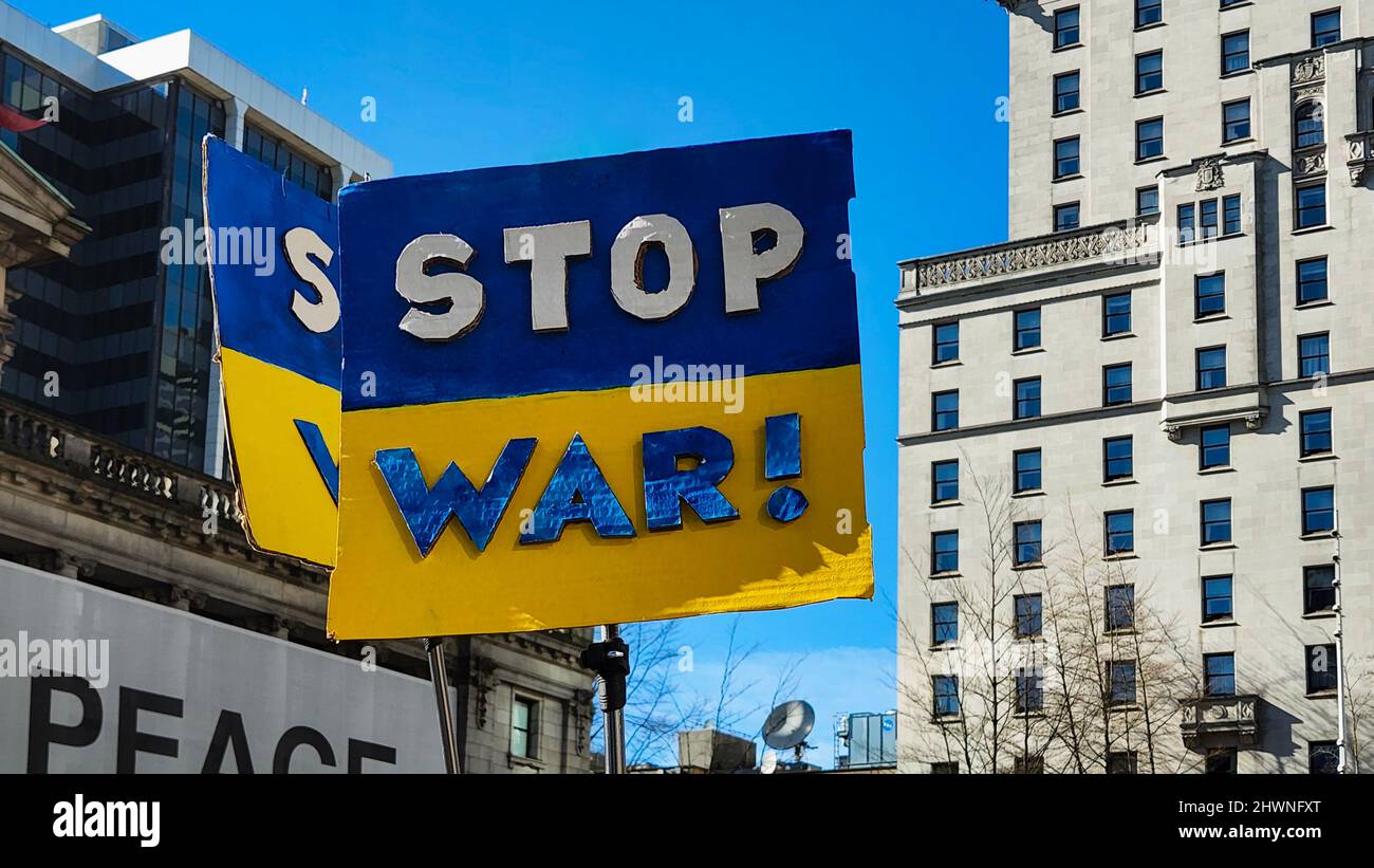 no war sign on a yellow-blue background raised on a stick between ...