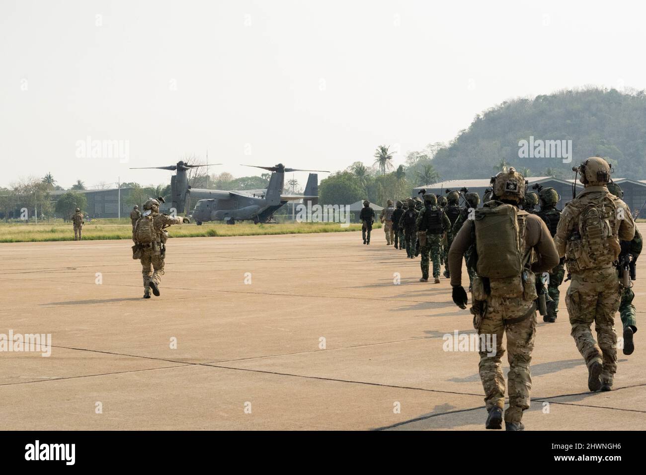 A combined U.S. and Thai ground force board a CV-22 Osprey assigned to ...