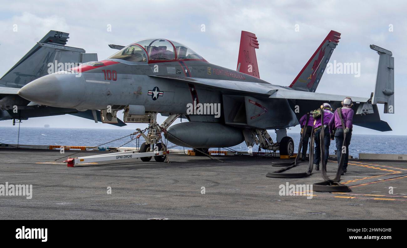 220305-N-LY692-1036 PACIFIC OCEAN (Mar. 05, 2022) Sailors restow a fuel ...