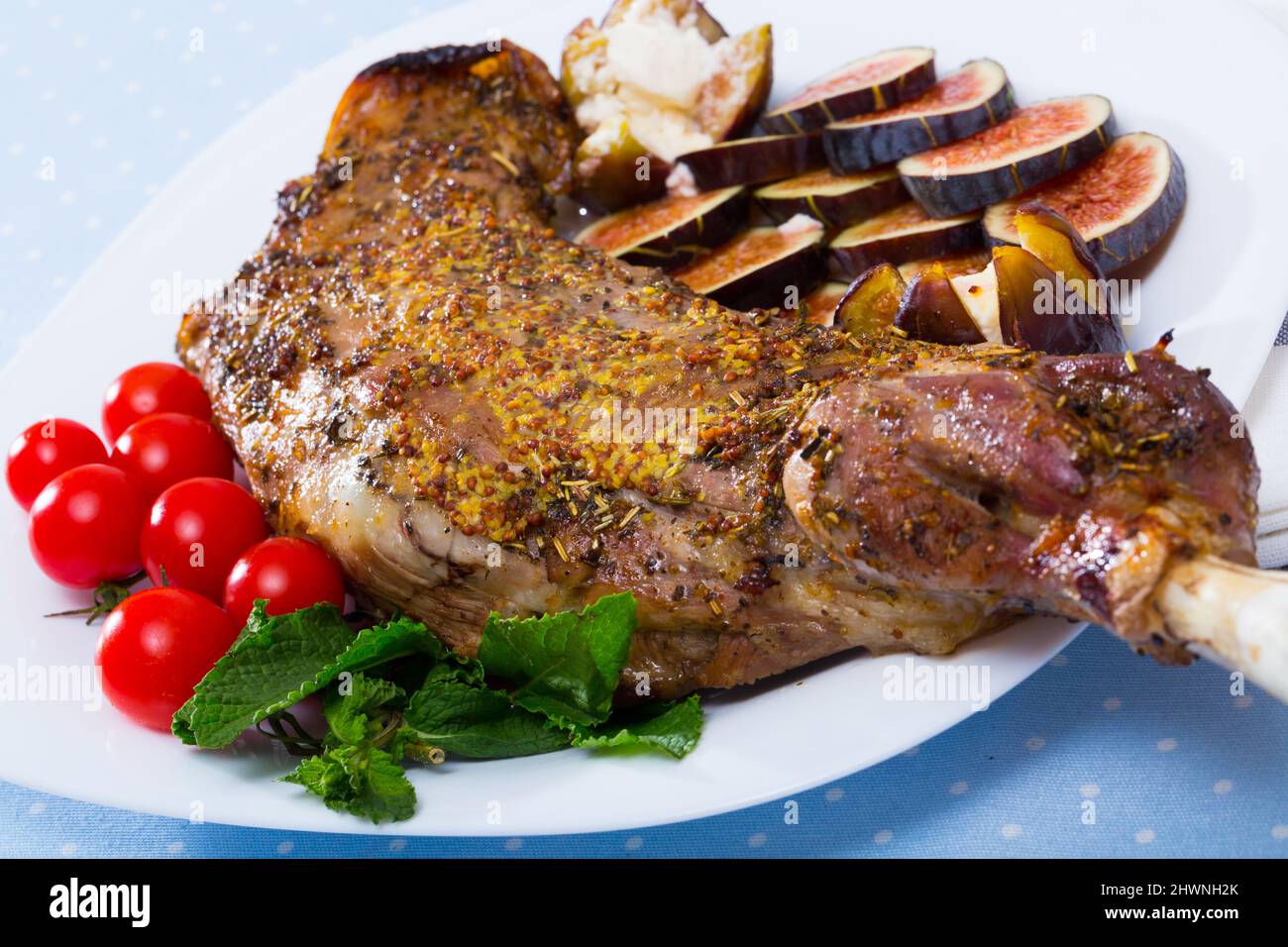 Gigot baked in oven with honey Stock Photo - Alamy