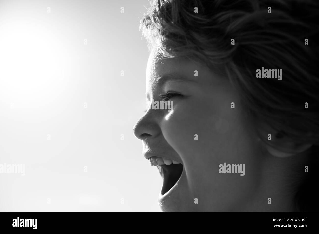 Portrait of a happy laughing child. Close up positive kid screaming ...