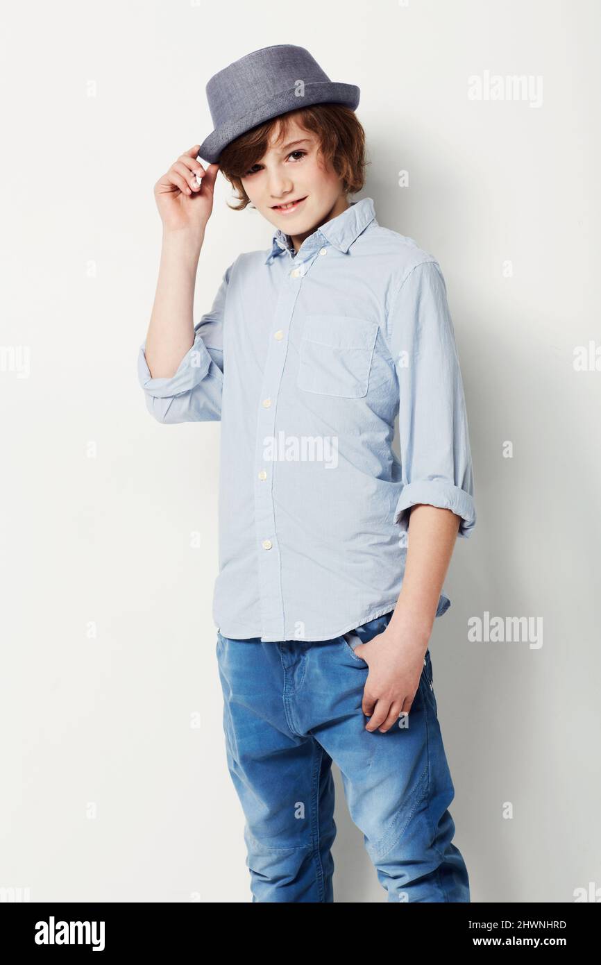 Looking suave. Cute preteen boy wearing trendy attire while isolated on ...