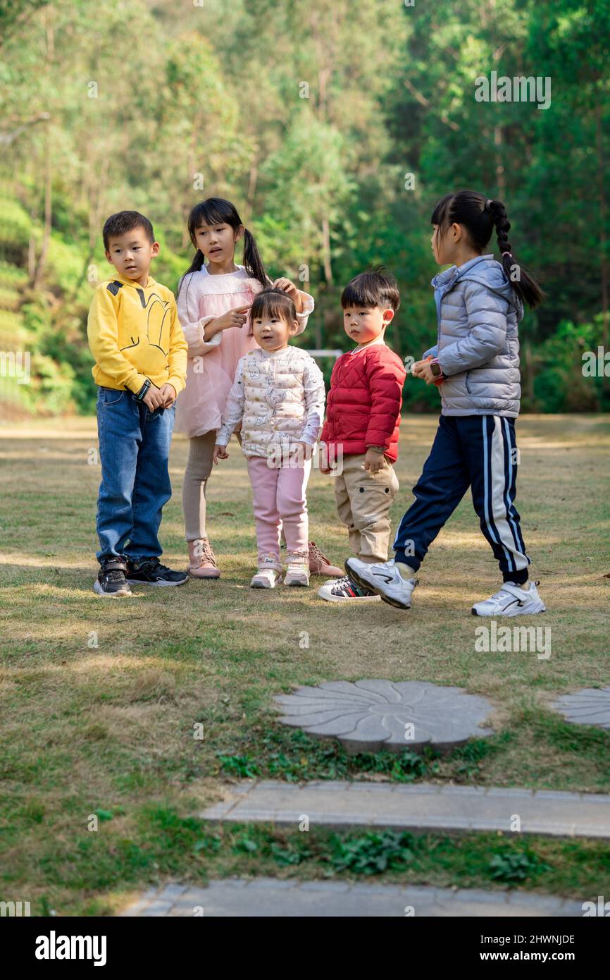 Little friends playing together in the park Stock Photo - Alamy