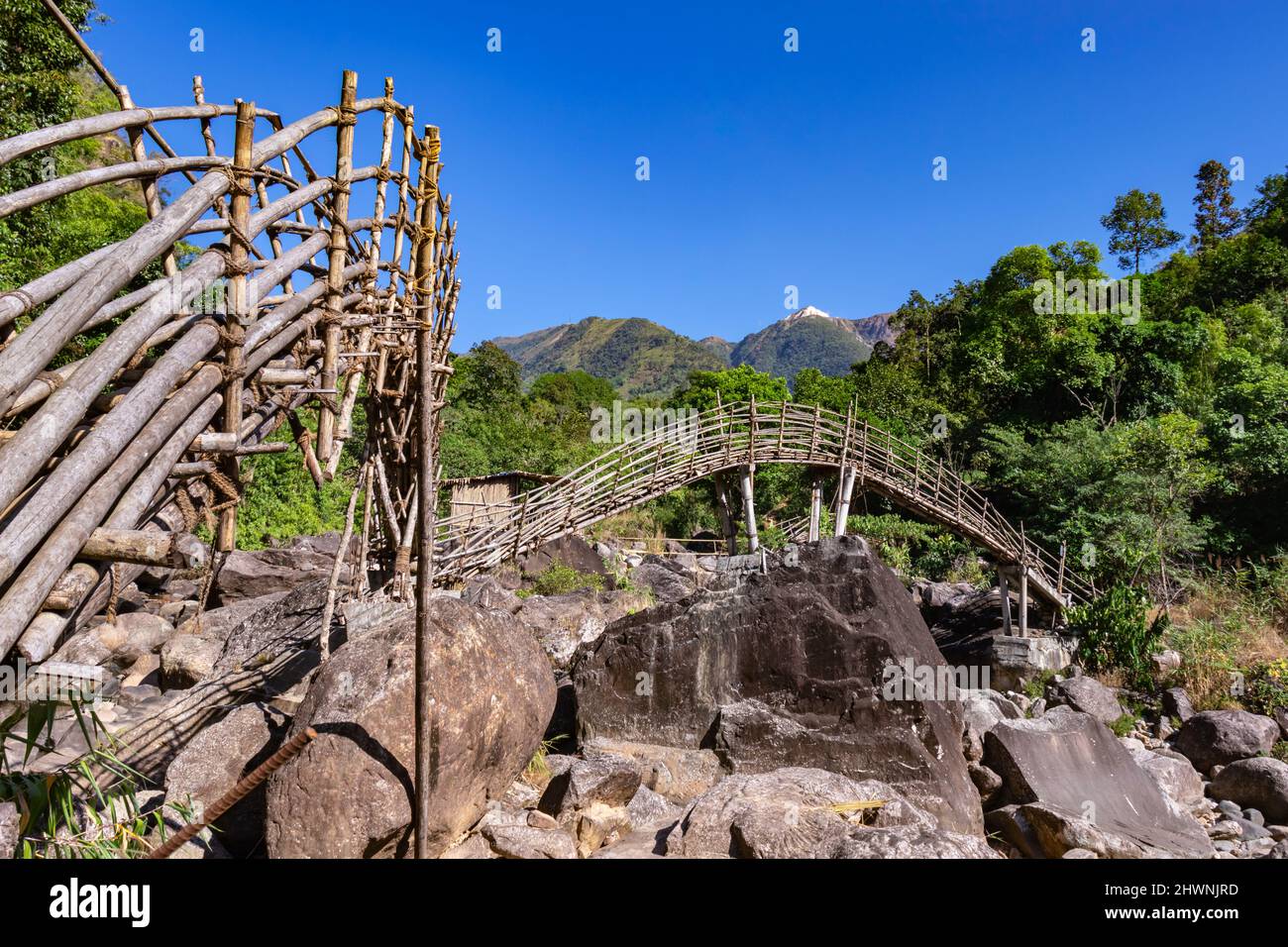traditional bamboo bridge for crossing mountain river at forest at ...