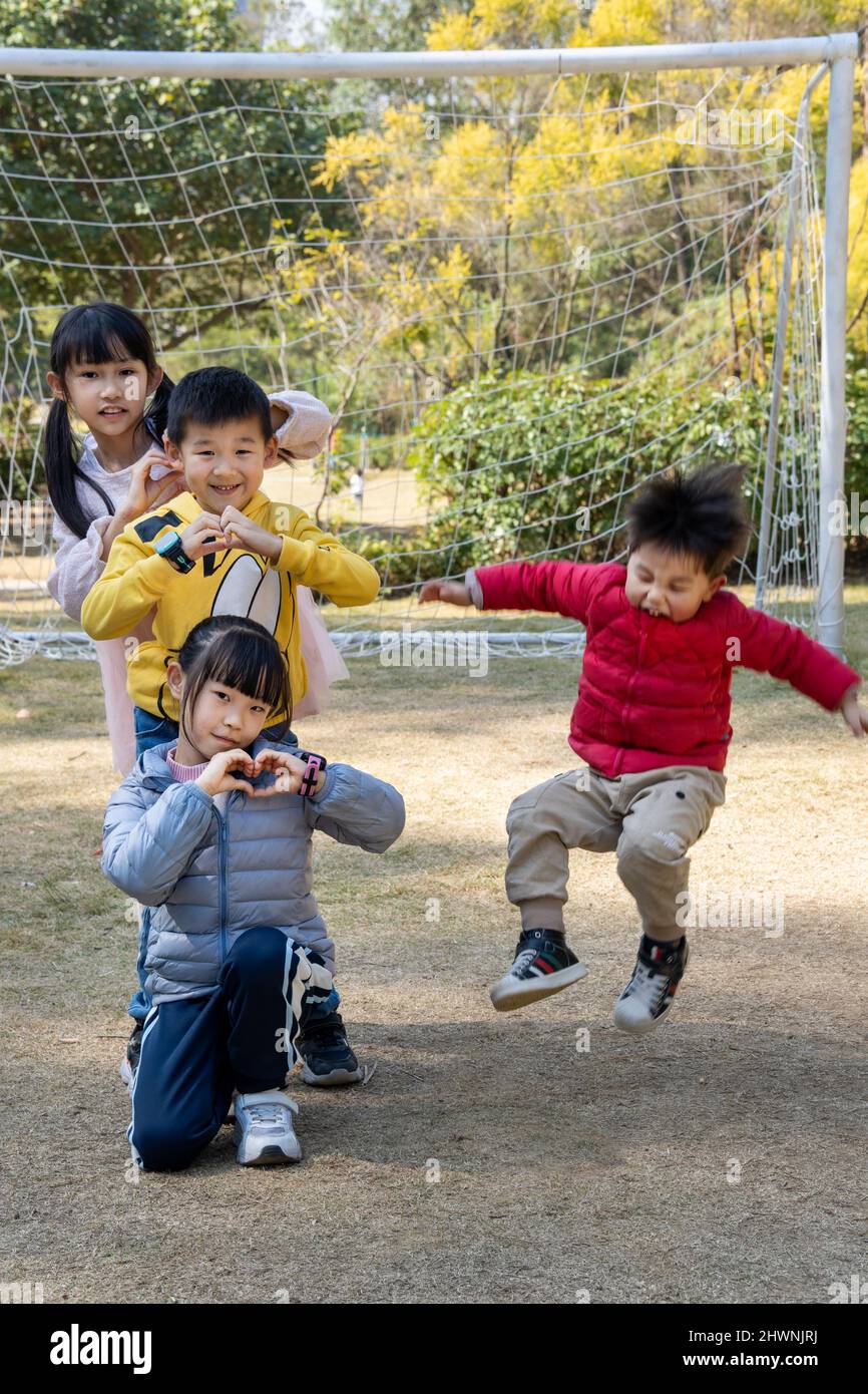 Little friends playing together in the park Stock Photo - Alamy