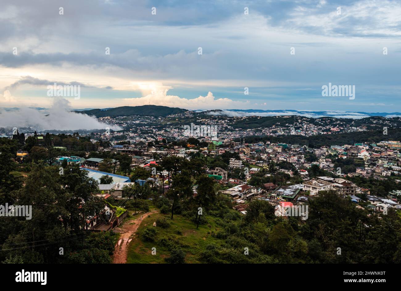 downtown city view with dramatic cloudy sky at evening from mountain ...