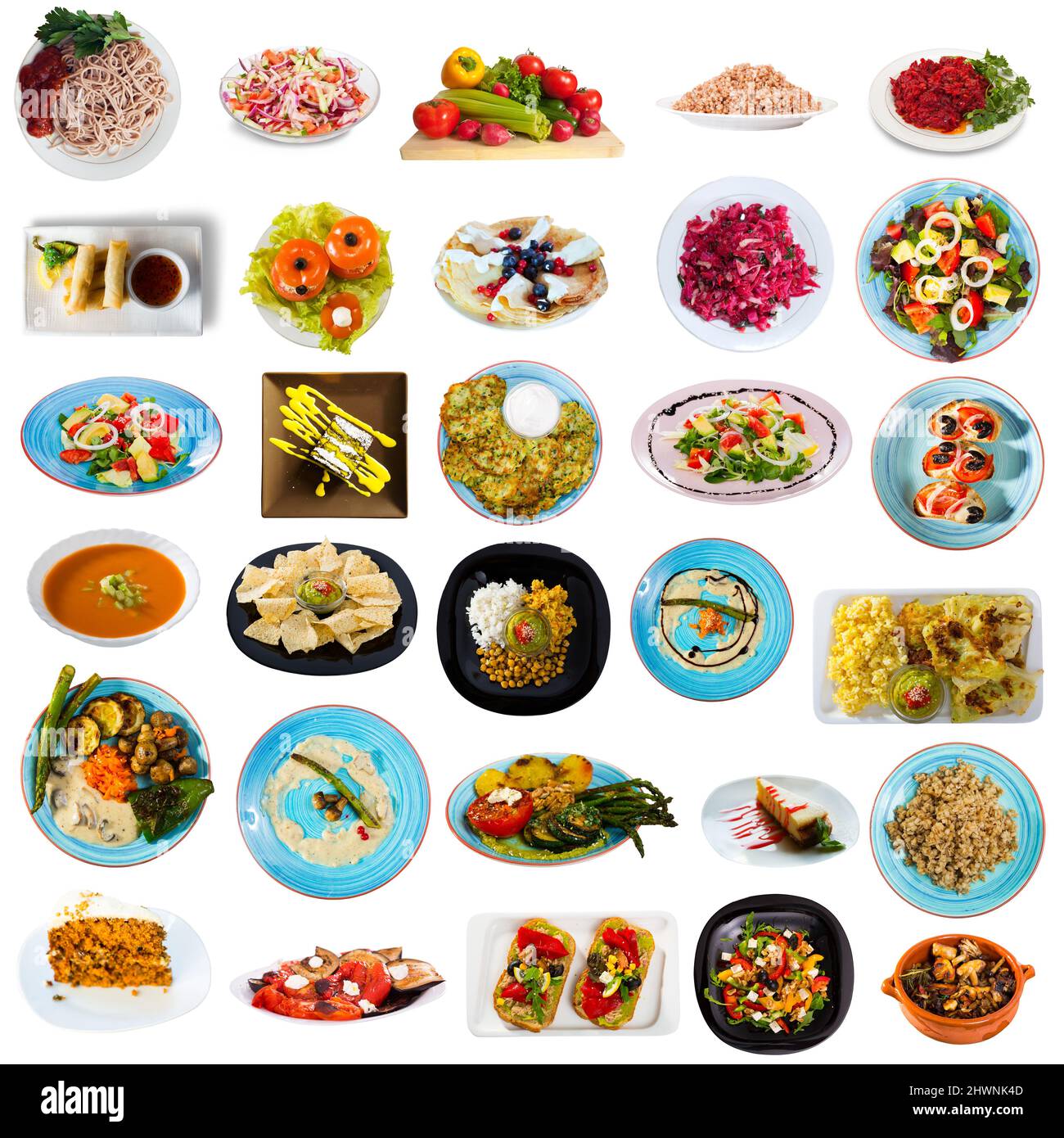 Many plates with tasty vegetarian food isolated on white background ...