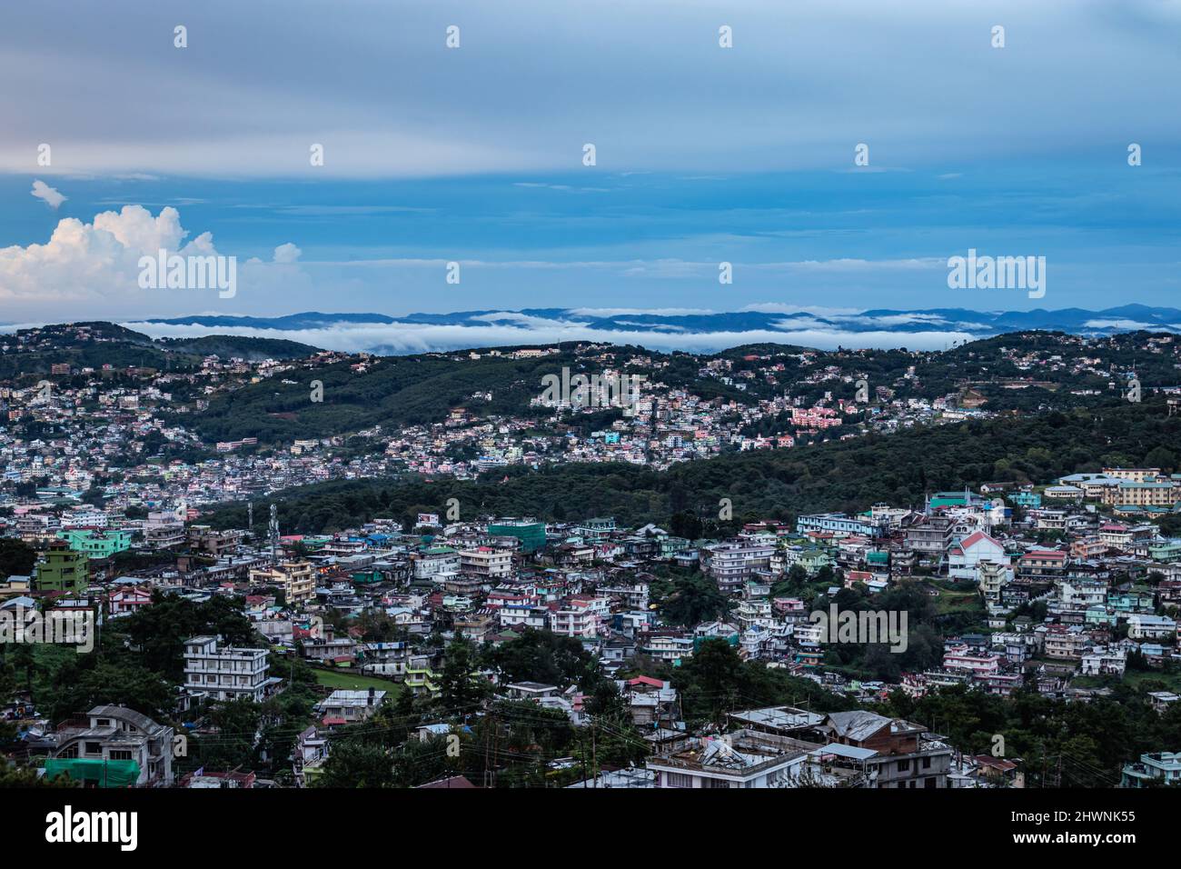 downtown city view with dramatic cloudy sky at evening from mountain ...