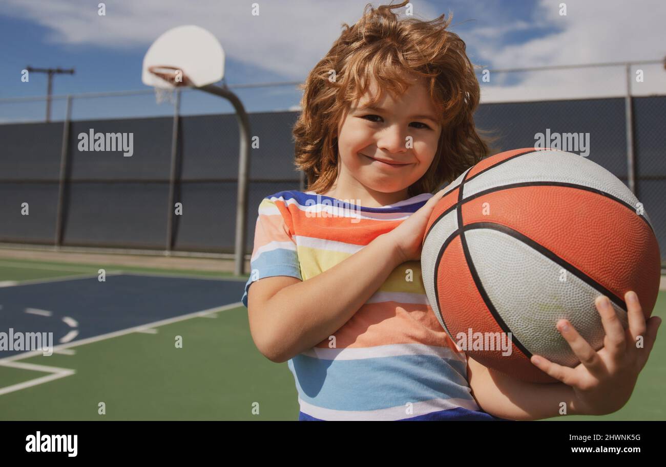 Little child boy playing basketball with basket ball. Active kids ...