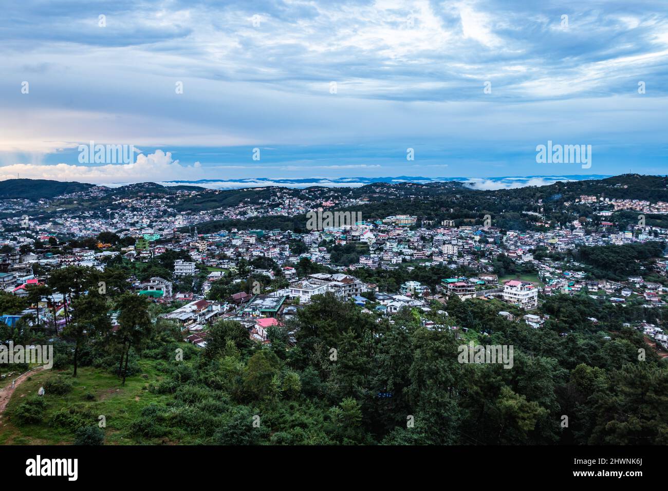 downtown city view with dramatic cloudy sky at evening from mountain ...