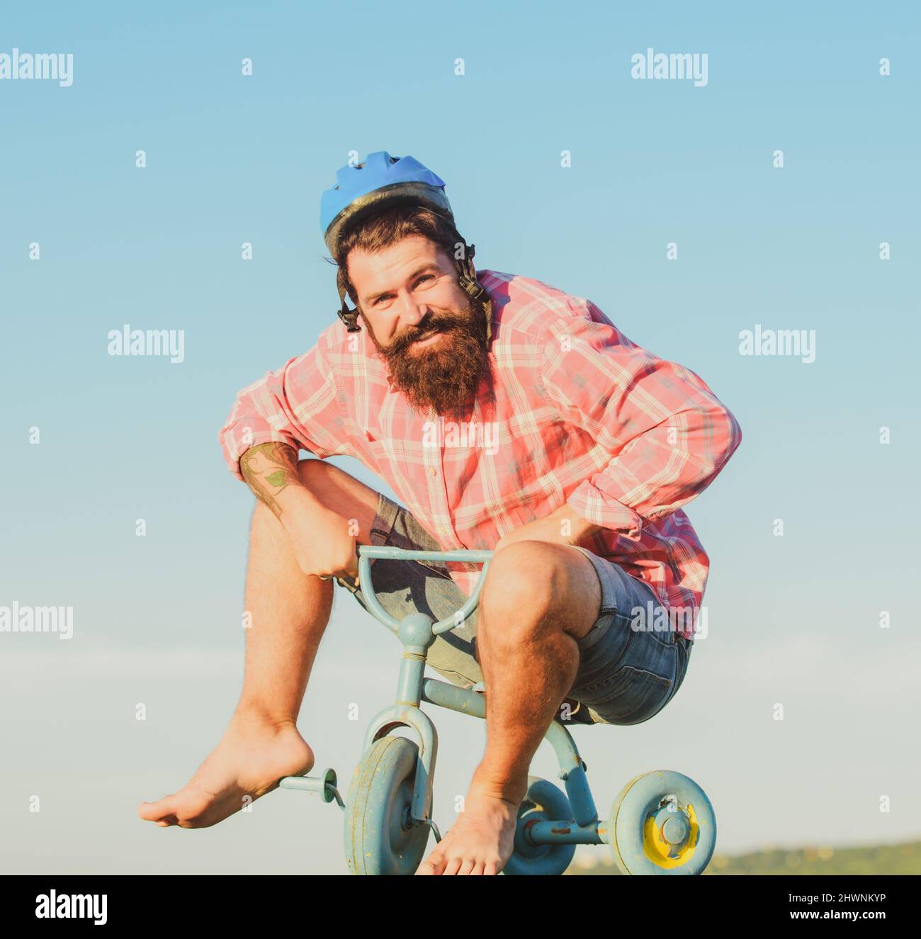 Funny biker, bicycle rider. Comic man ride bike Stock Photo - Alamy