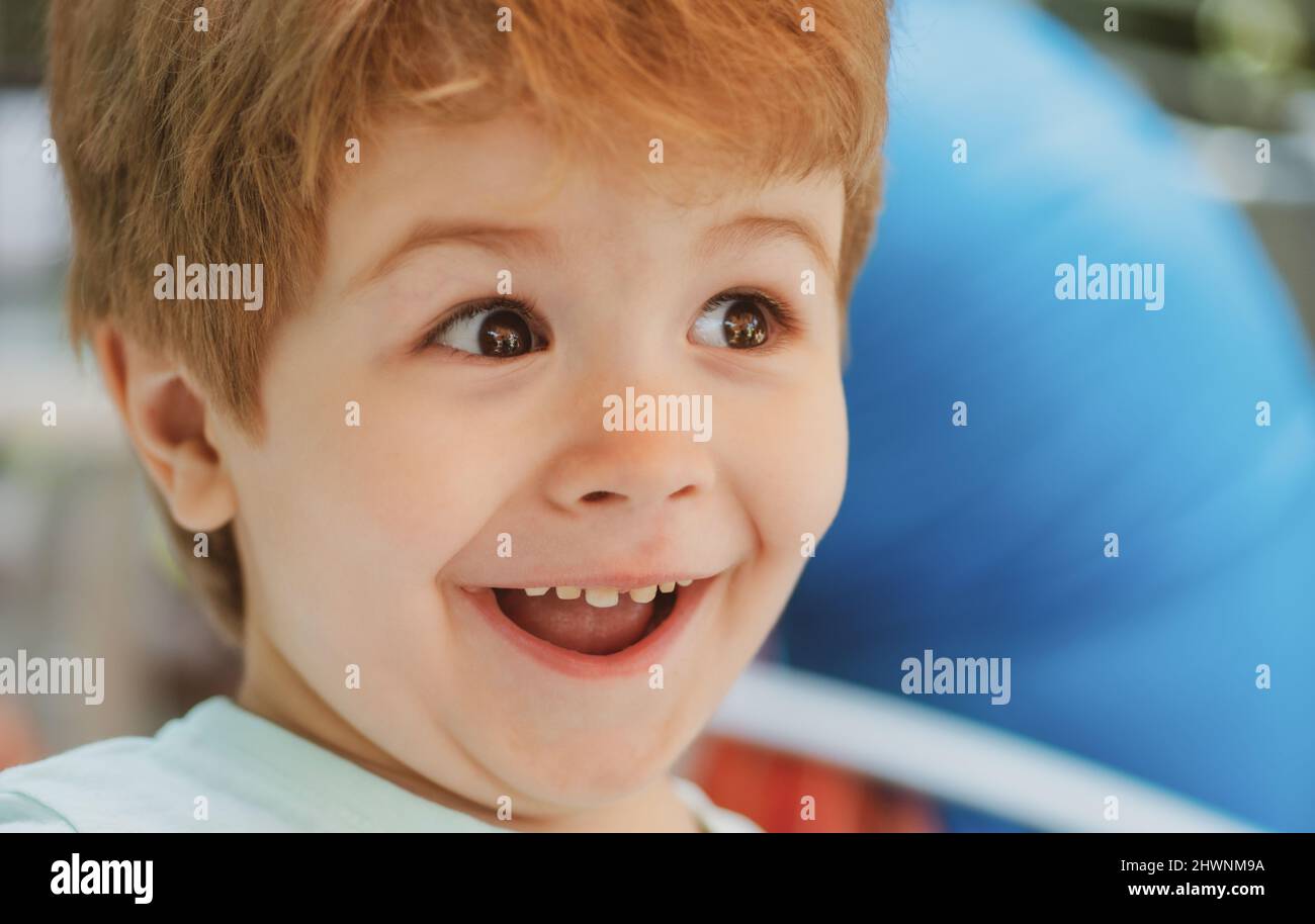 Portrait of a amazed surprised child. Close up expression kids face ...