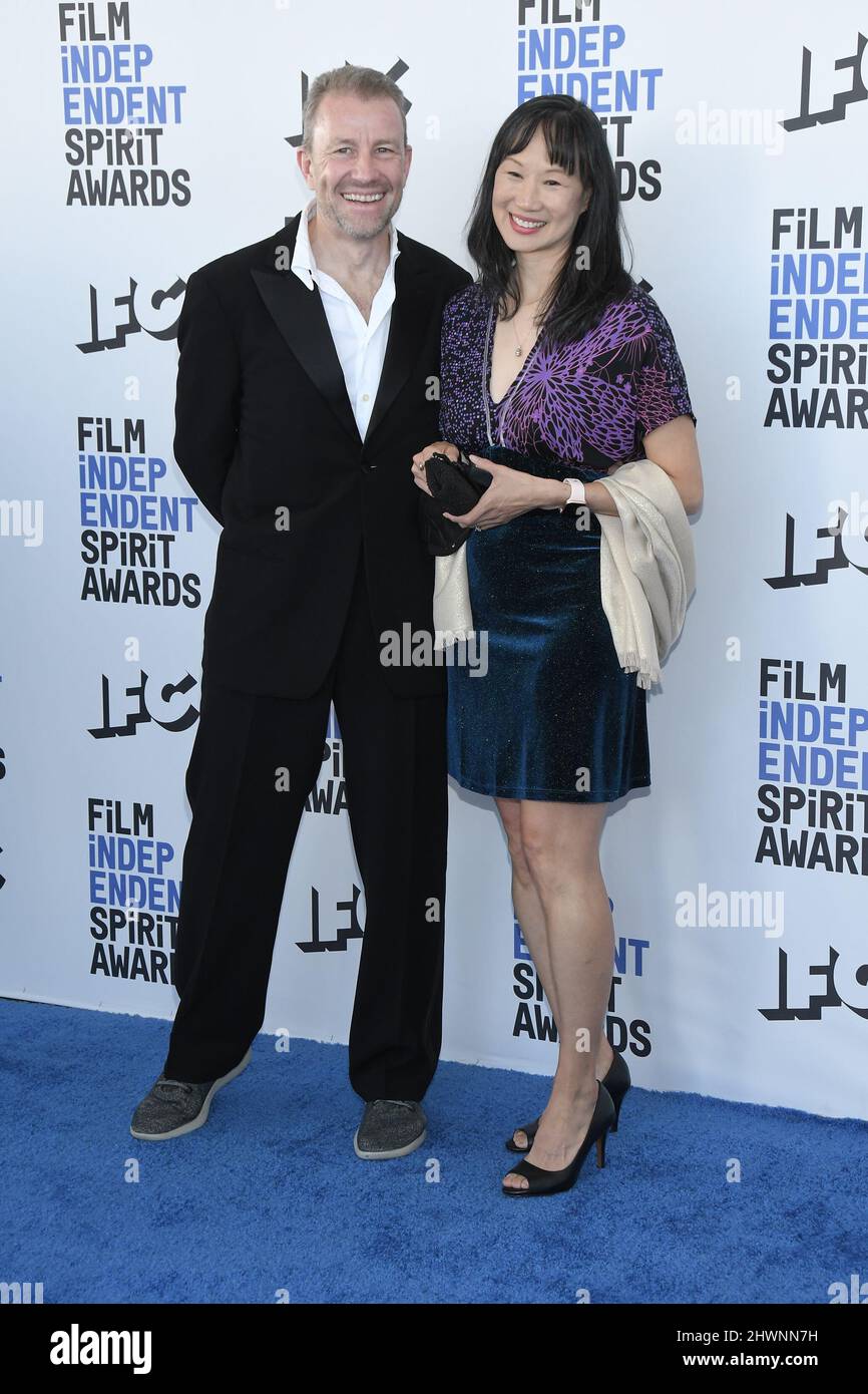 Guest and Debbie Lum arrive at the 2022 Film Independent Spirit Awards ...