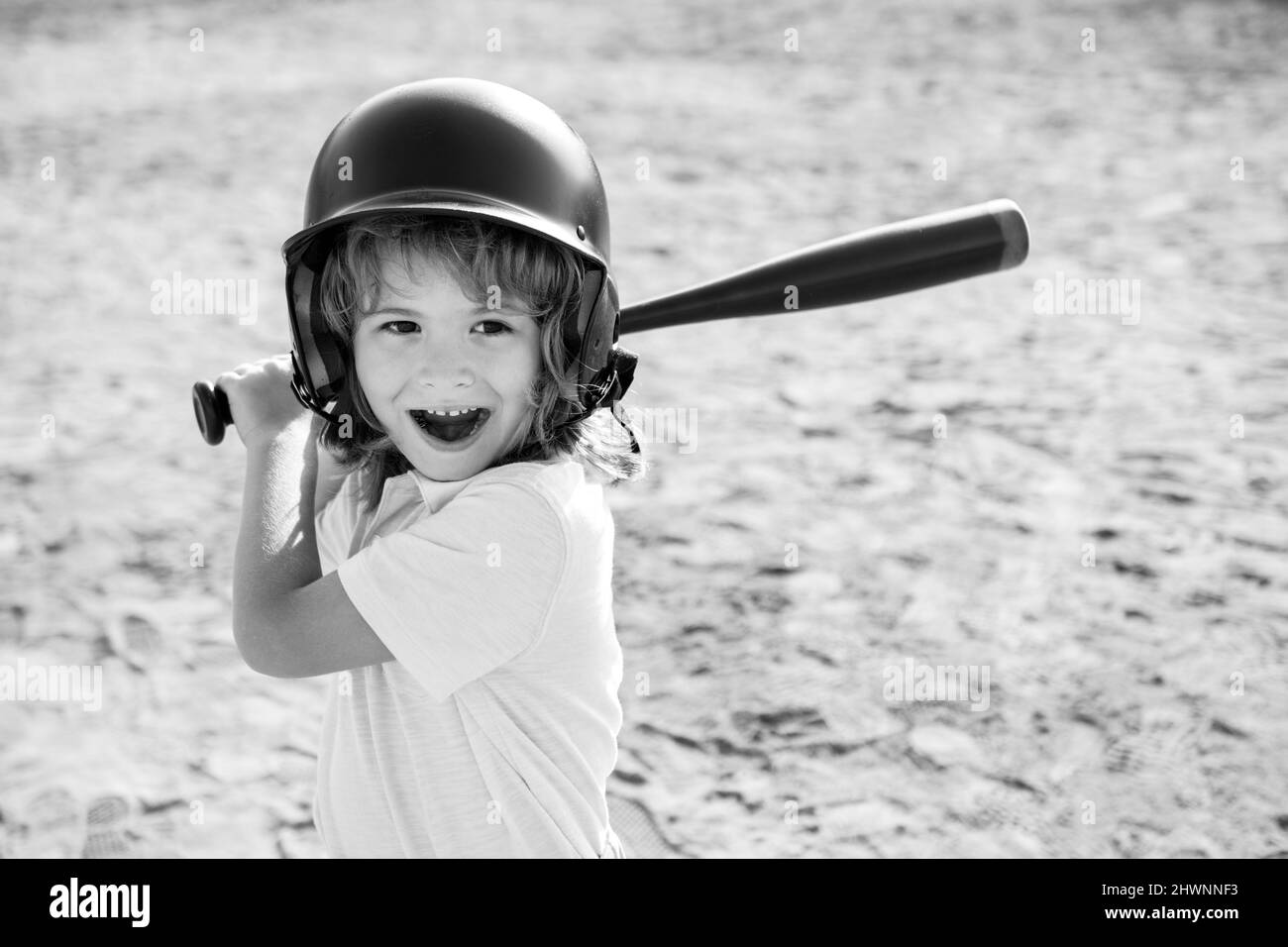 Child baseball player focused ready to bat. Kid holding a baseball bat ...