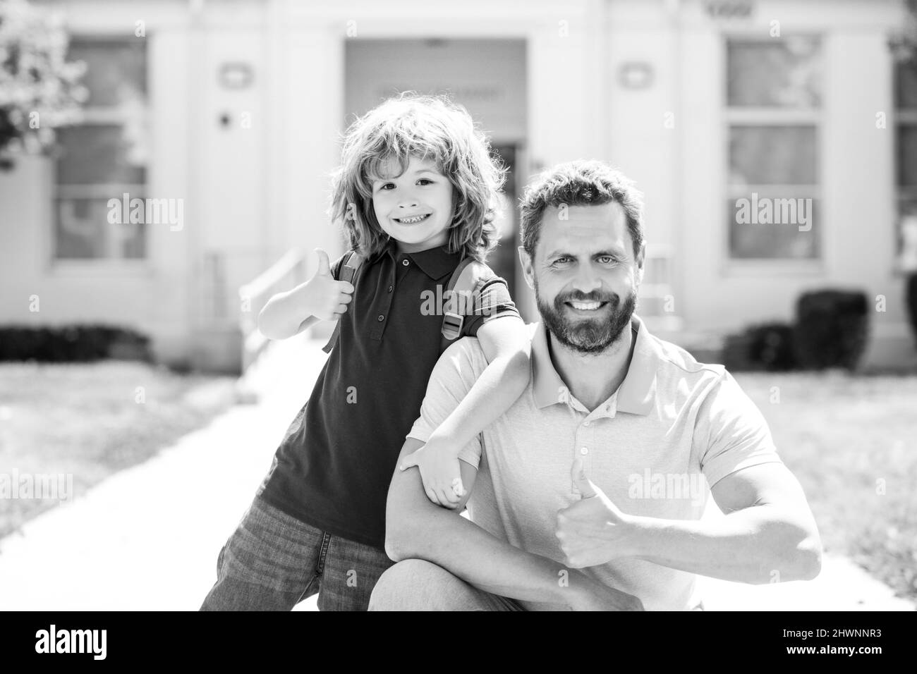 Happy face. Father and son with thumbs up sign after come back from ...