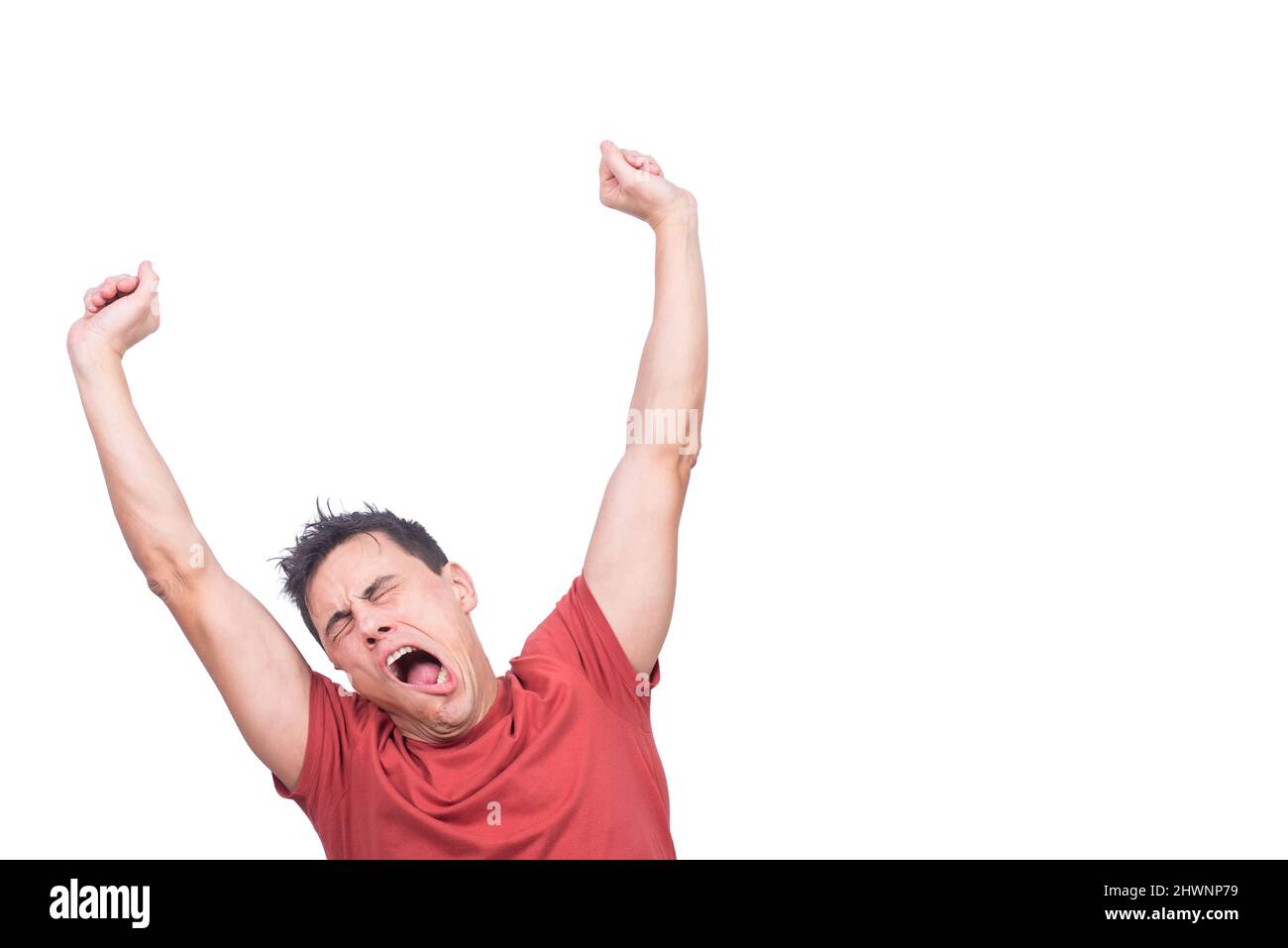 Yawning man stretching arms in light studio Stock Photo - Alamy