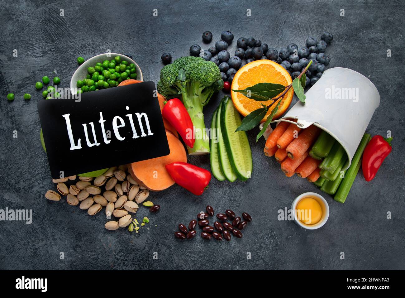 Foods high in lutein on dark background. Food for healthy eyes. High in ...