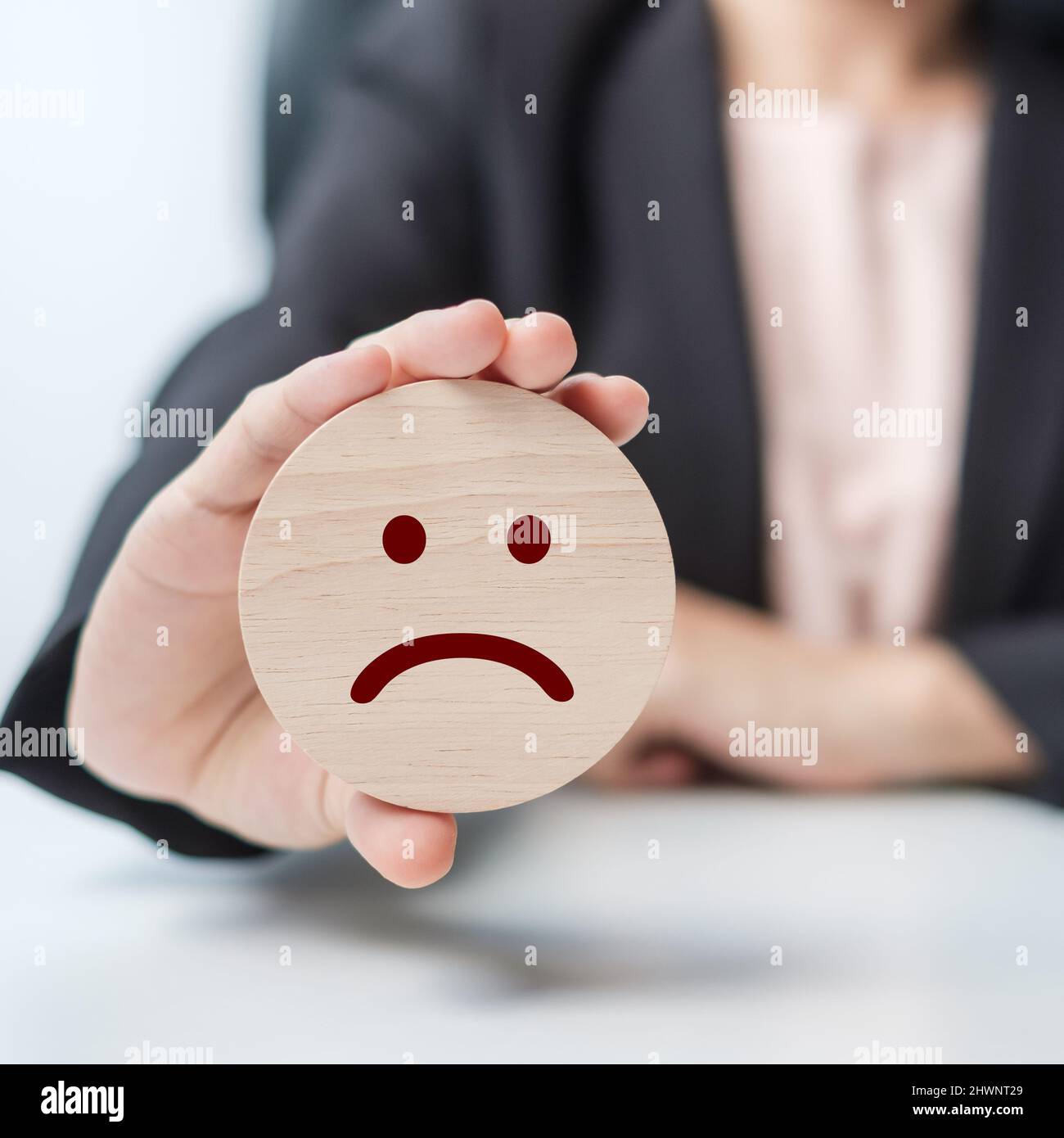 hand holding angry face block. Customer choose Emoticon for user ...