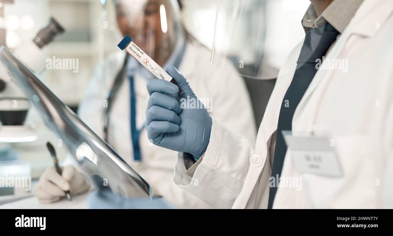 Dealing with another positive case. Closeup shot of an unrecognisable ...