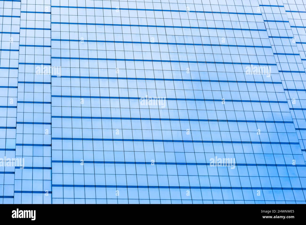 Blue glass windows of office building for background Stock Photo - Alamy