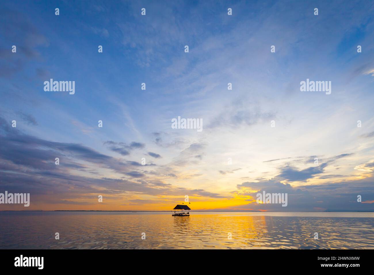 Pontoon floating on the water at sunset background Stock Photo - Alamy