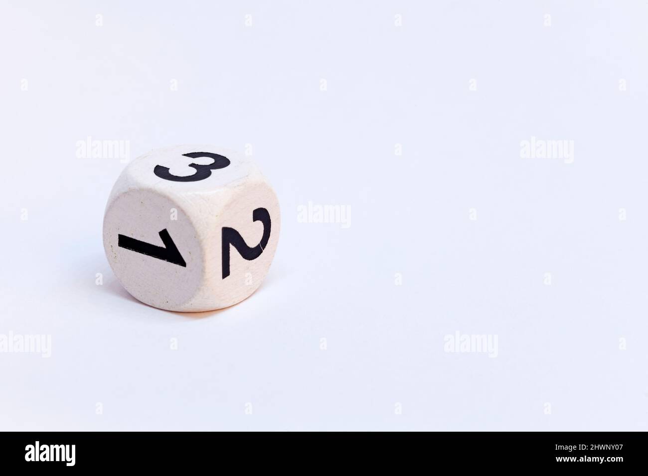 a white dice with Arabic numerals Stock Photo - Alamy