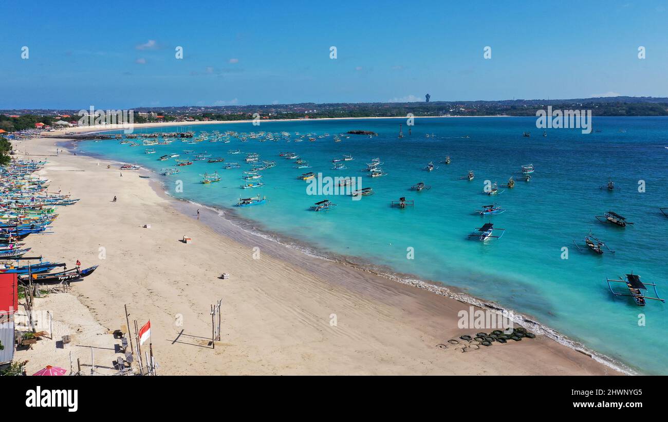 Tropical sand beach with traditional fishing boat on background azure ...