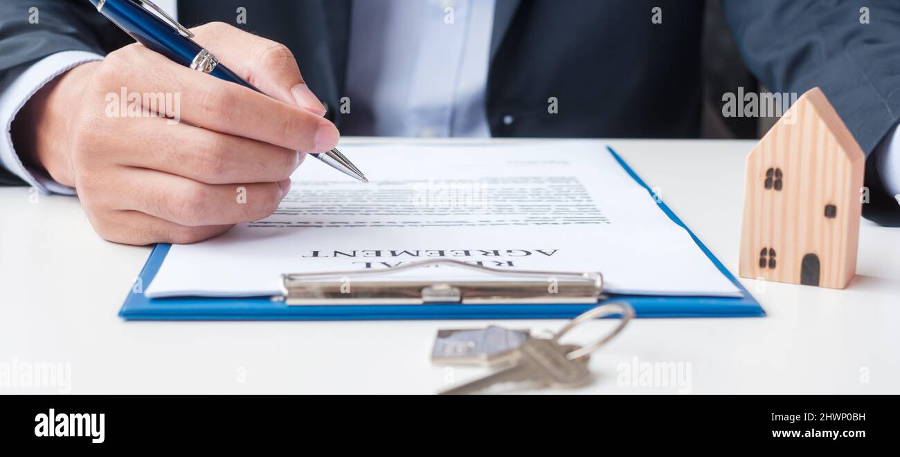 man signing home contract documents. Contract agreement, real estate ...