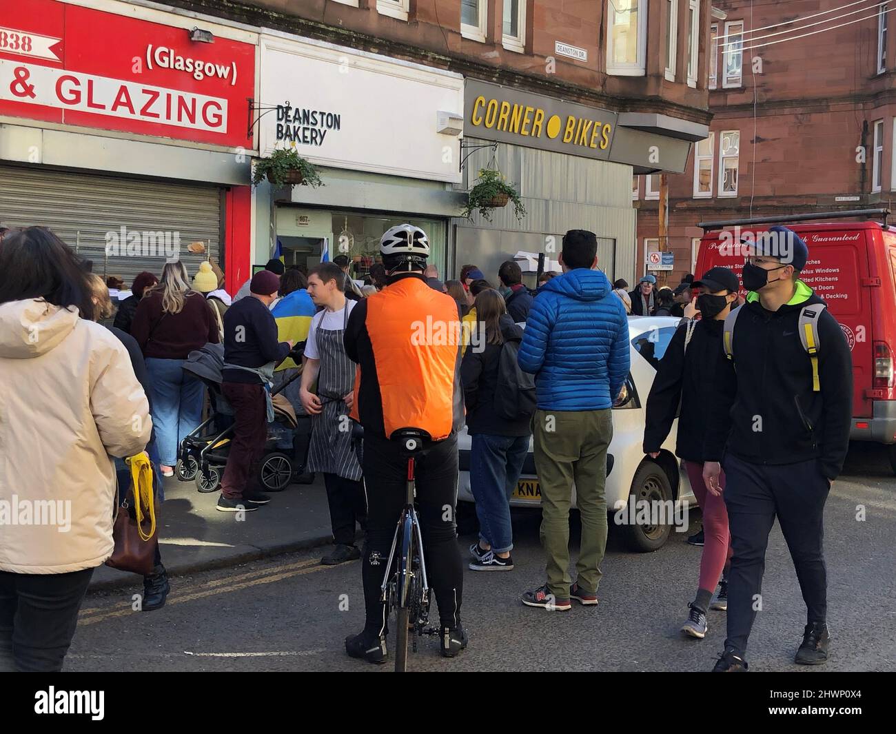 People queue around the block to buy cakes, buns and other baked treats ...
