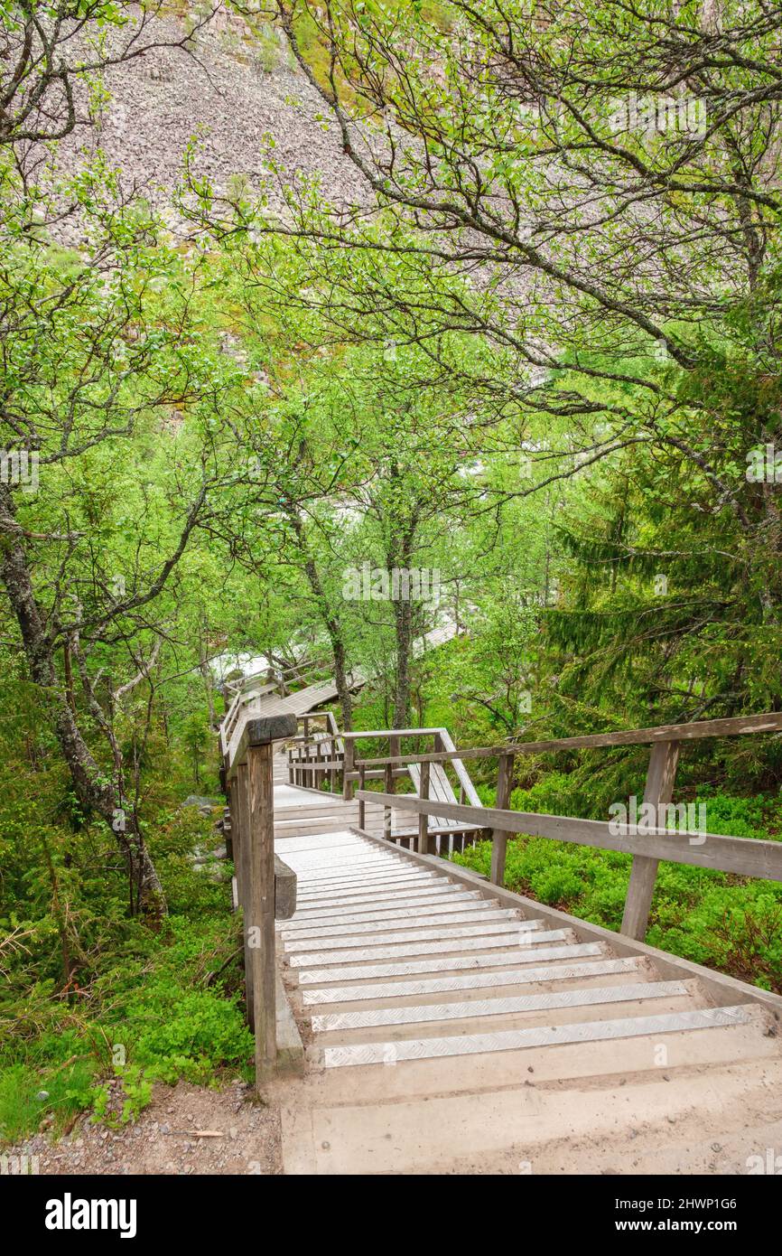 Hiking trail with stairs down into a ravine Stock Photo - Alamy