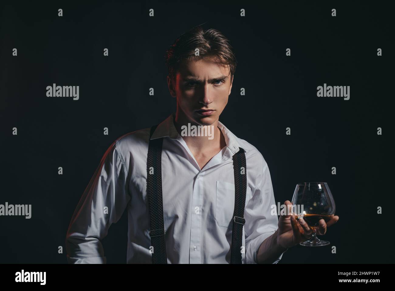 Man drinking whiskey, brandy, cognac. Degustation and tasting. Man with ...