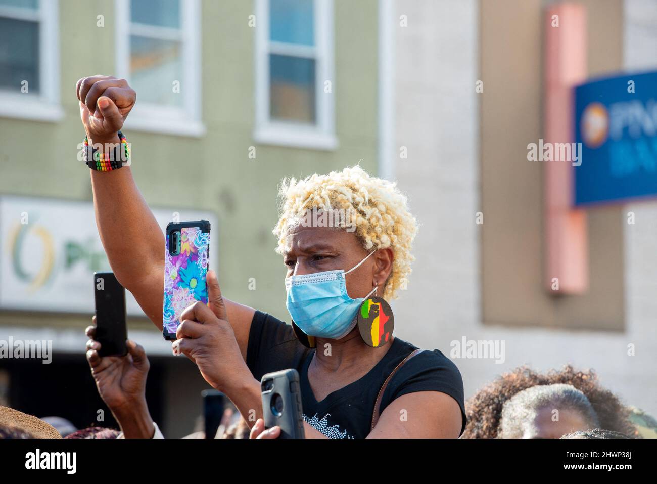 Crowd Participant raises hand in excitement prior to crossing of The ...