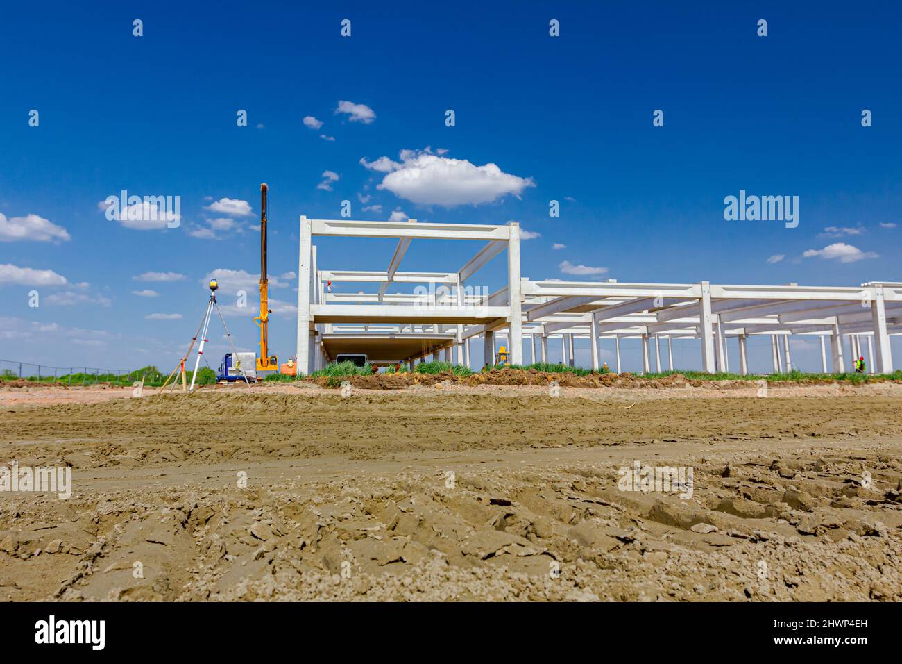 Mobile crane is assembly concrete skeleton of industrial building, with ...