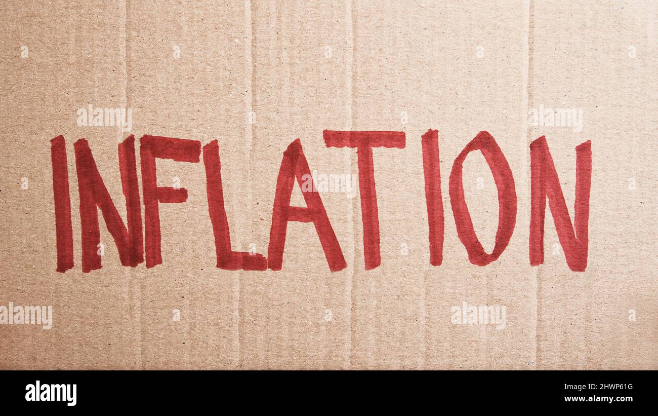 World economic crisis and inflation concept, Paper sheet with word ...