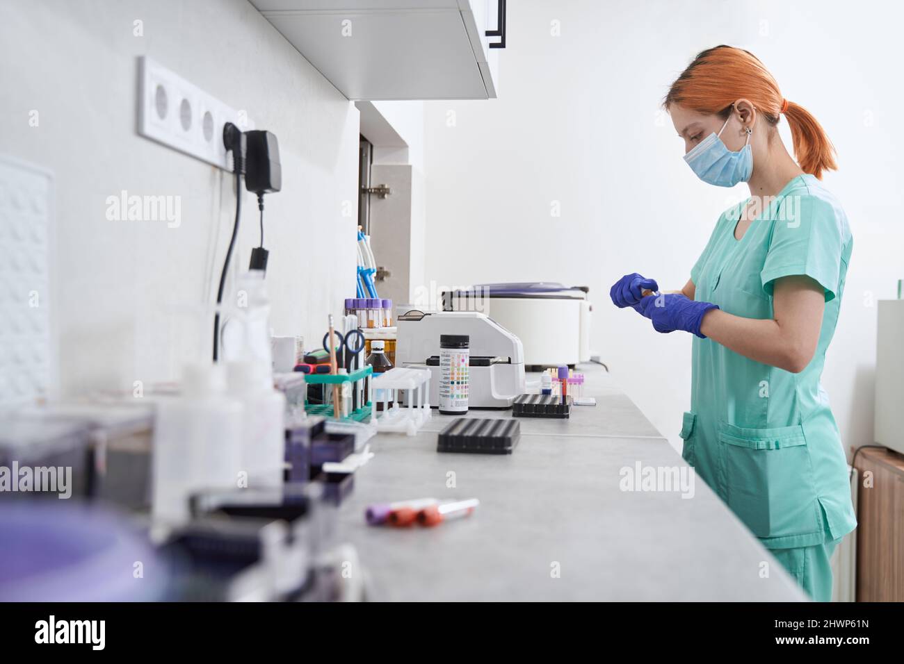 Doctor working with medical equipment in the laboratory Stock Photo - Alamy