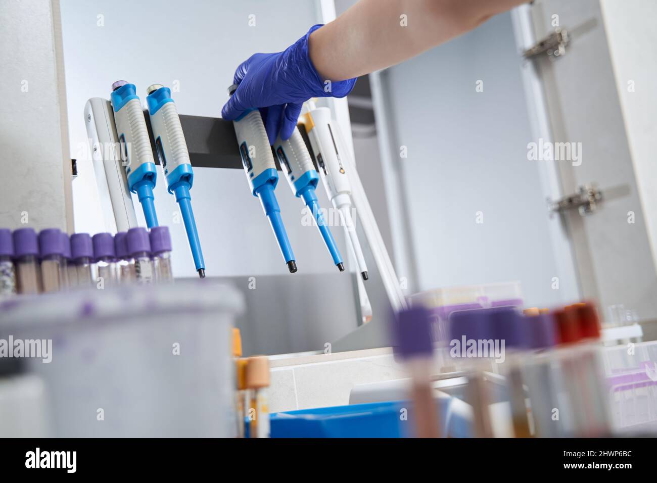 Female in medical suit working in laboratory Stock Photo - Alamy