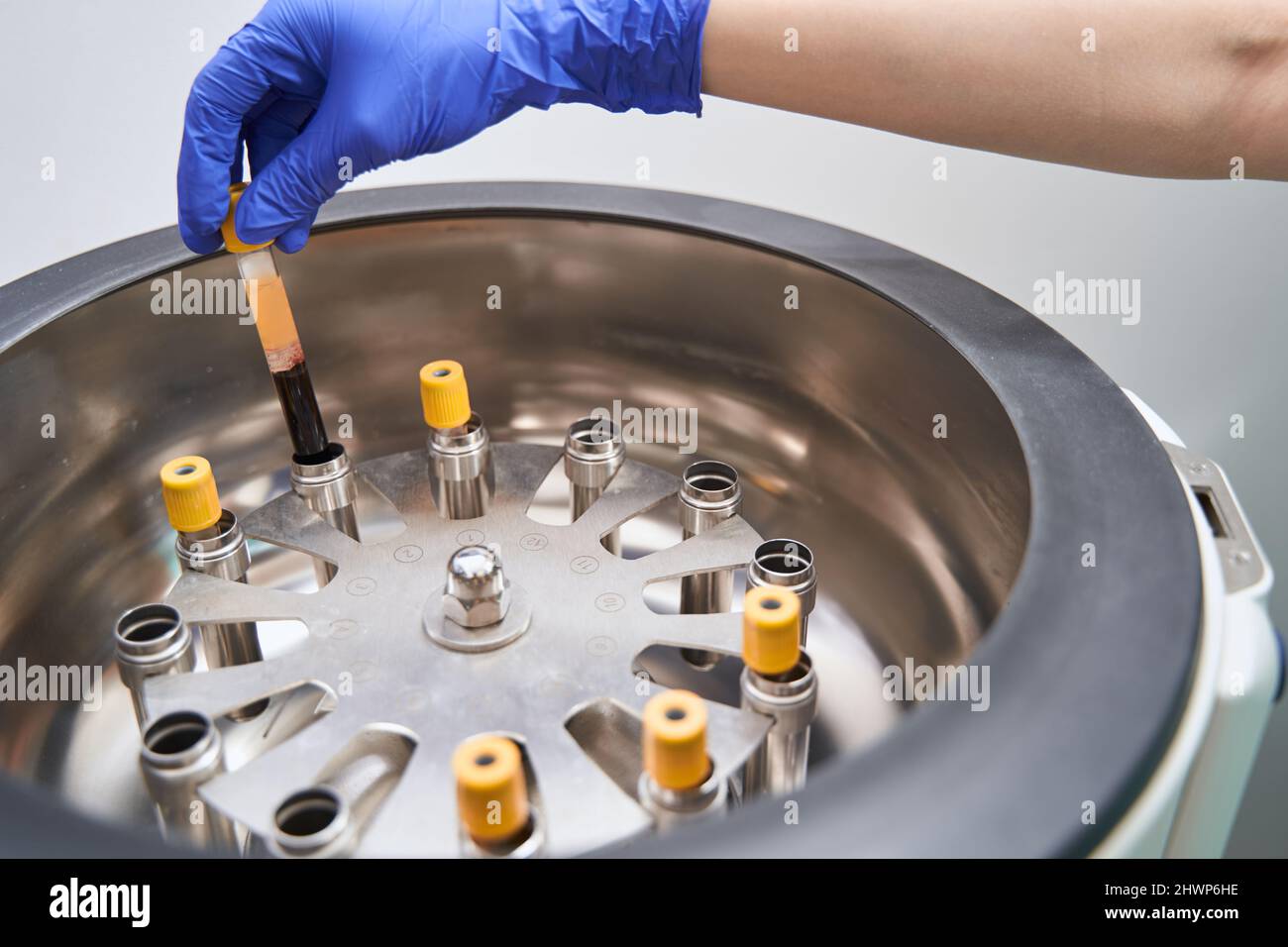 Lady doing medical research with centrifuge in hospital Stock Photo - Alamy