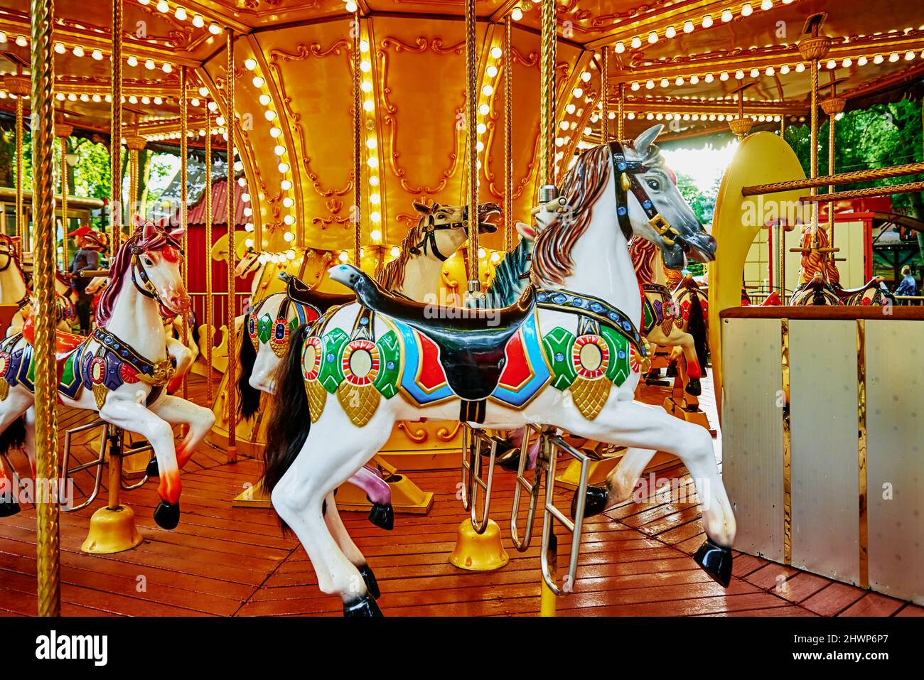 Carousel with colorful horses at amusement park, Merry go round with ...