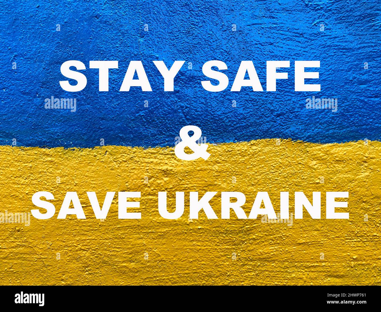 Stay Safe and Save Ukraine message on Ukrainian flag painted on wall ...