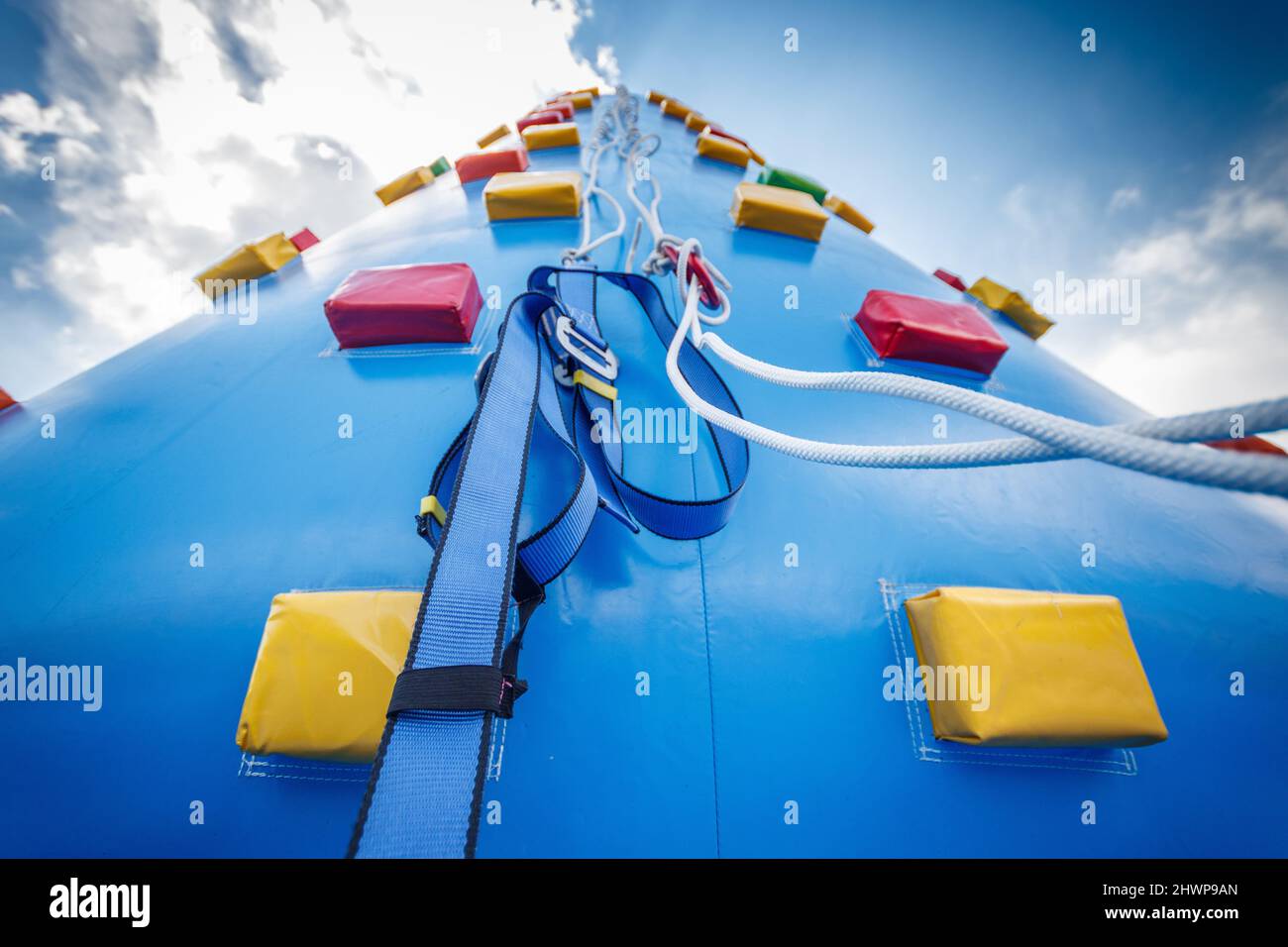 Climbing harness on a training inflatable obstacle course. Safety in ...