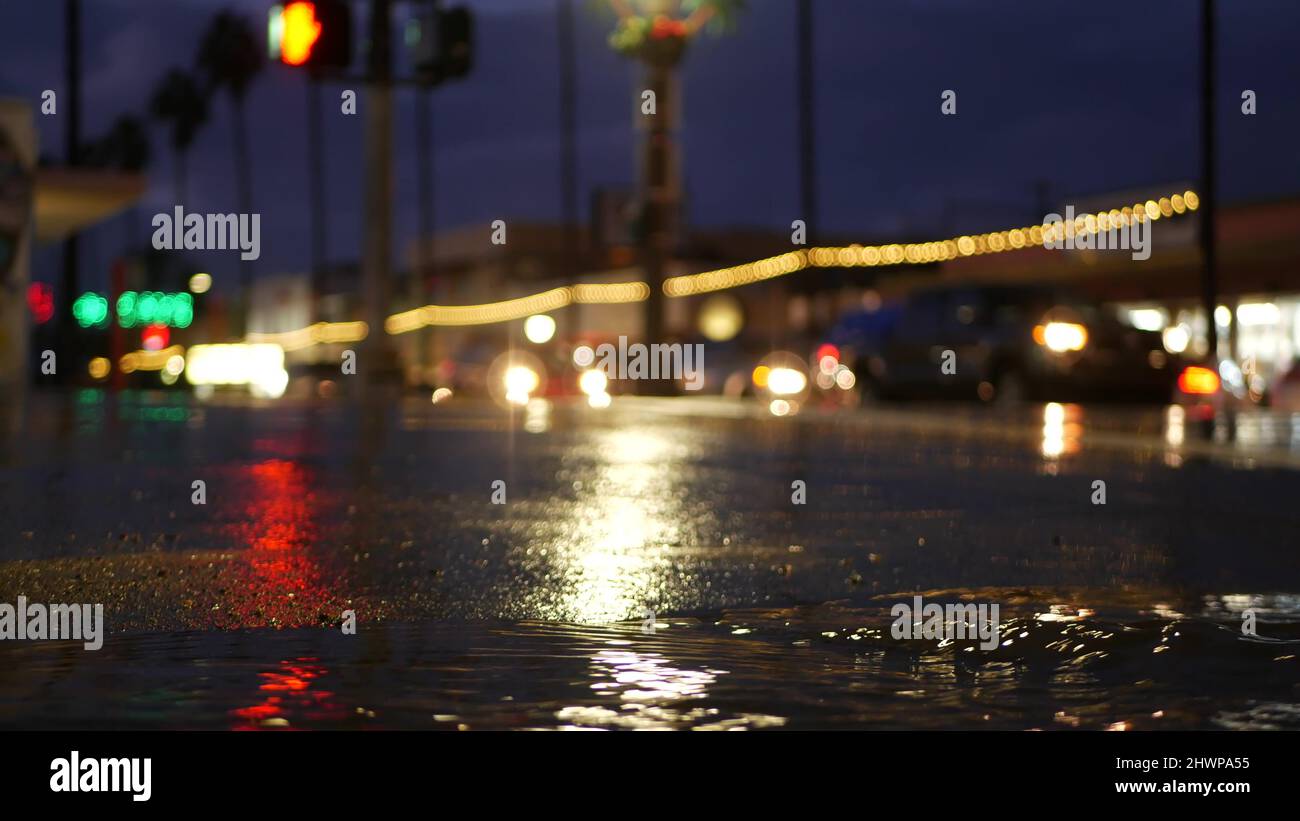 Cars lights reflection on road in rainy weather. Rain drops on wet ...