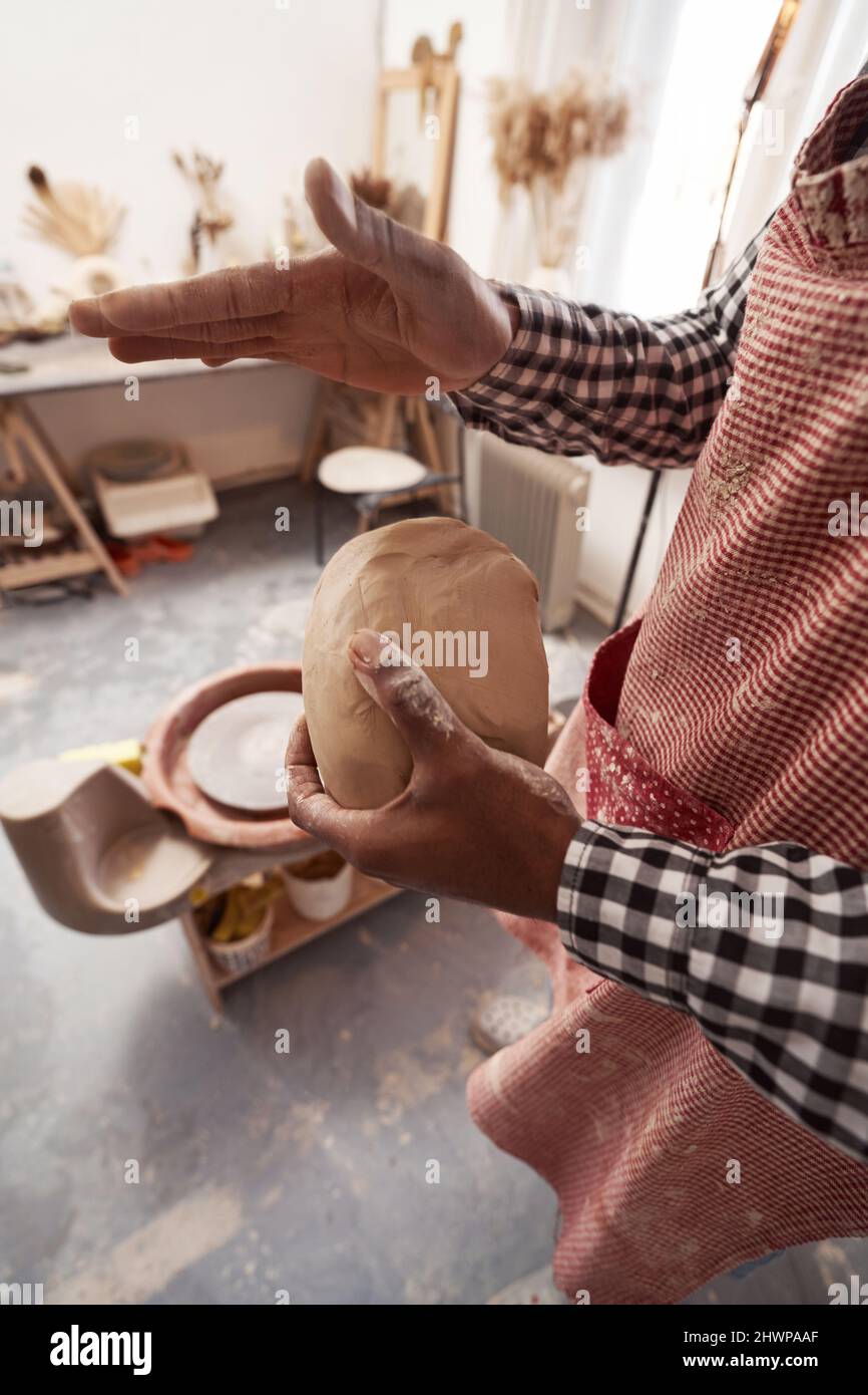 Experienced potter working in his pottery studio Stock Photo - Alamy