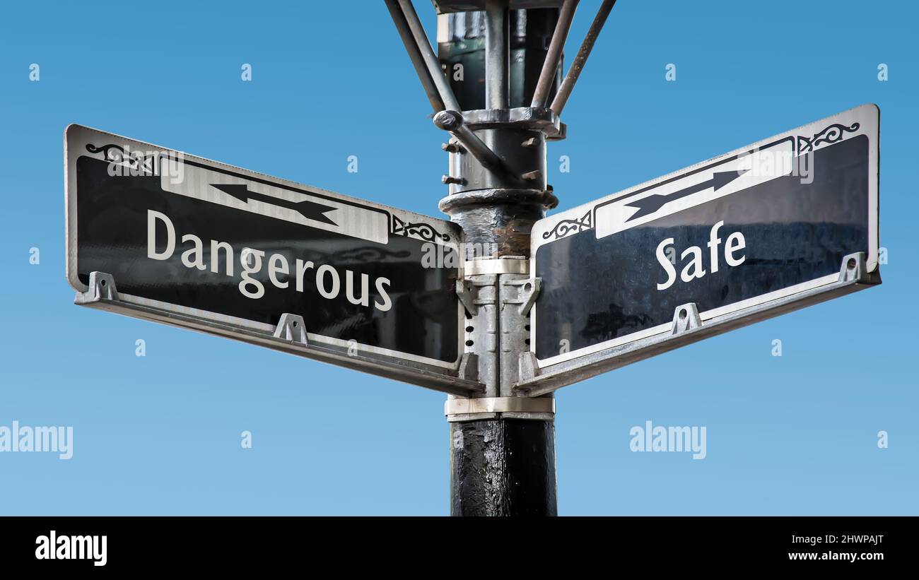Street Sign the Direction Way to Safe versus Dangerous Stock Photo - Alamy