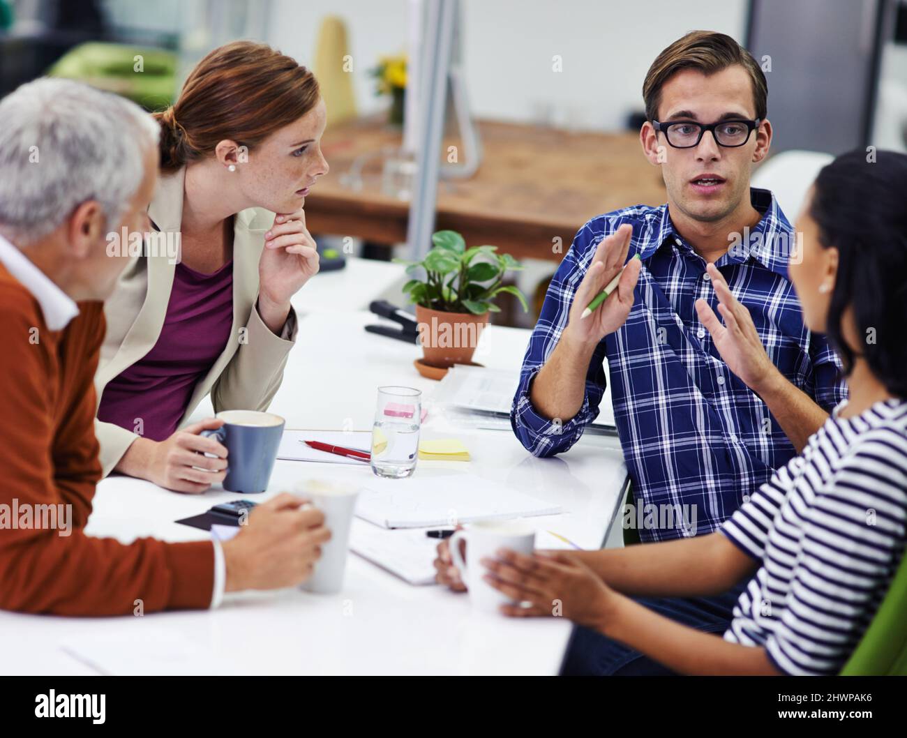 Hes got vision. A cropped shot of a group of professionals having a ...