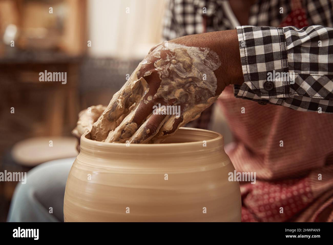 Potter making ceramic vessel in his workshop Stock Photo - Alamy