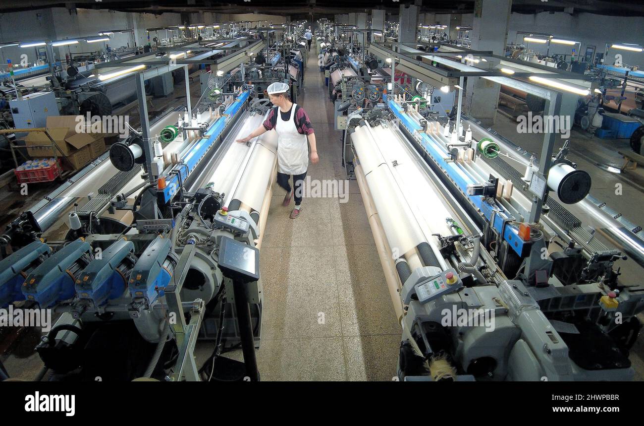 HAIAN, CHINA - MARCH 7, 2022 - An employee controls a imported high-end ...