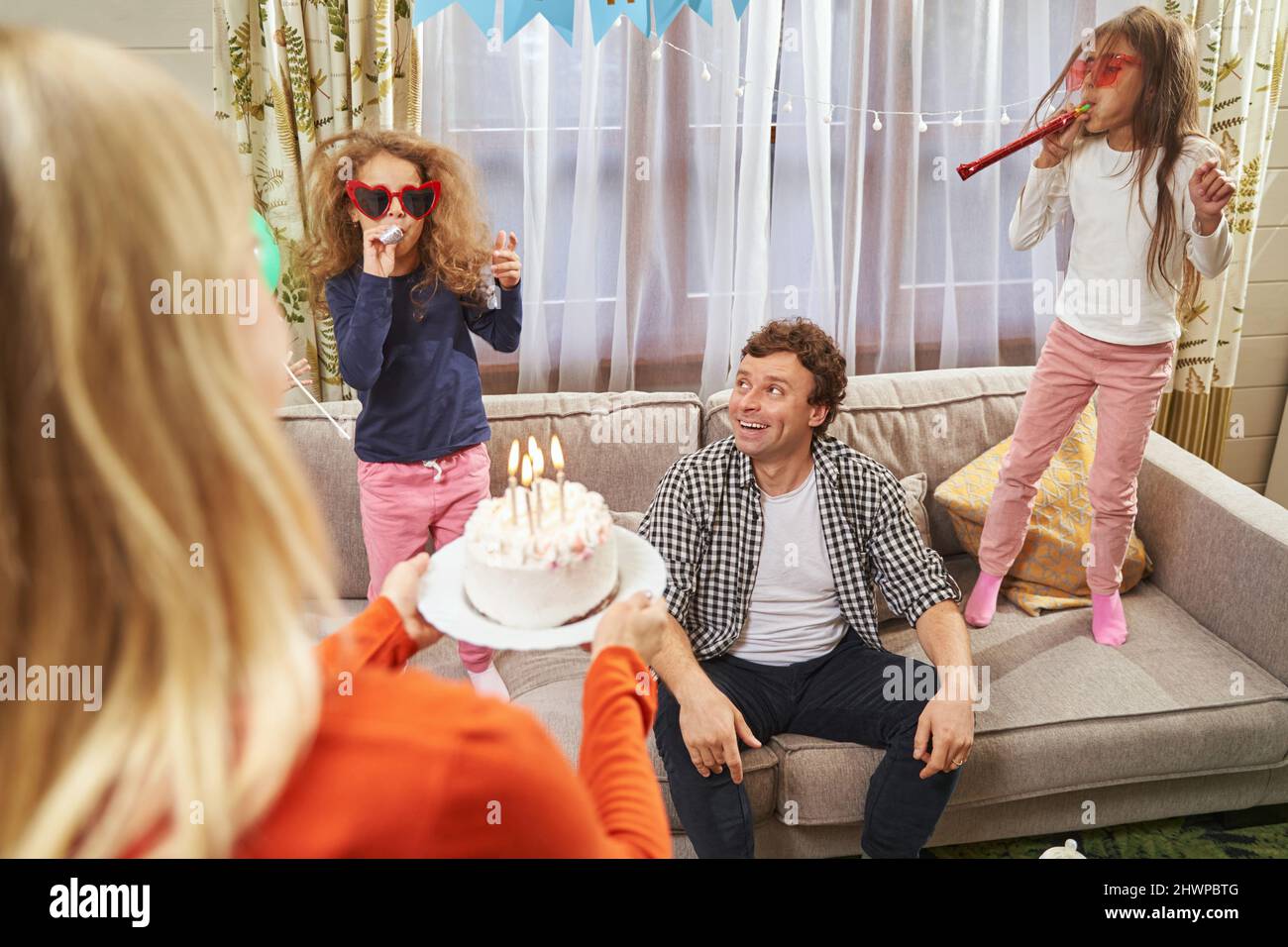 Happy family celebrating birthday and having fun at home Stock Photo ...