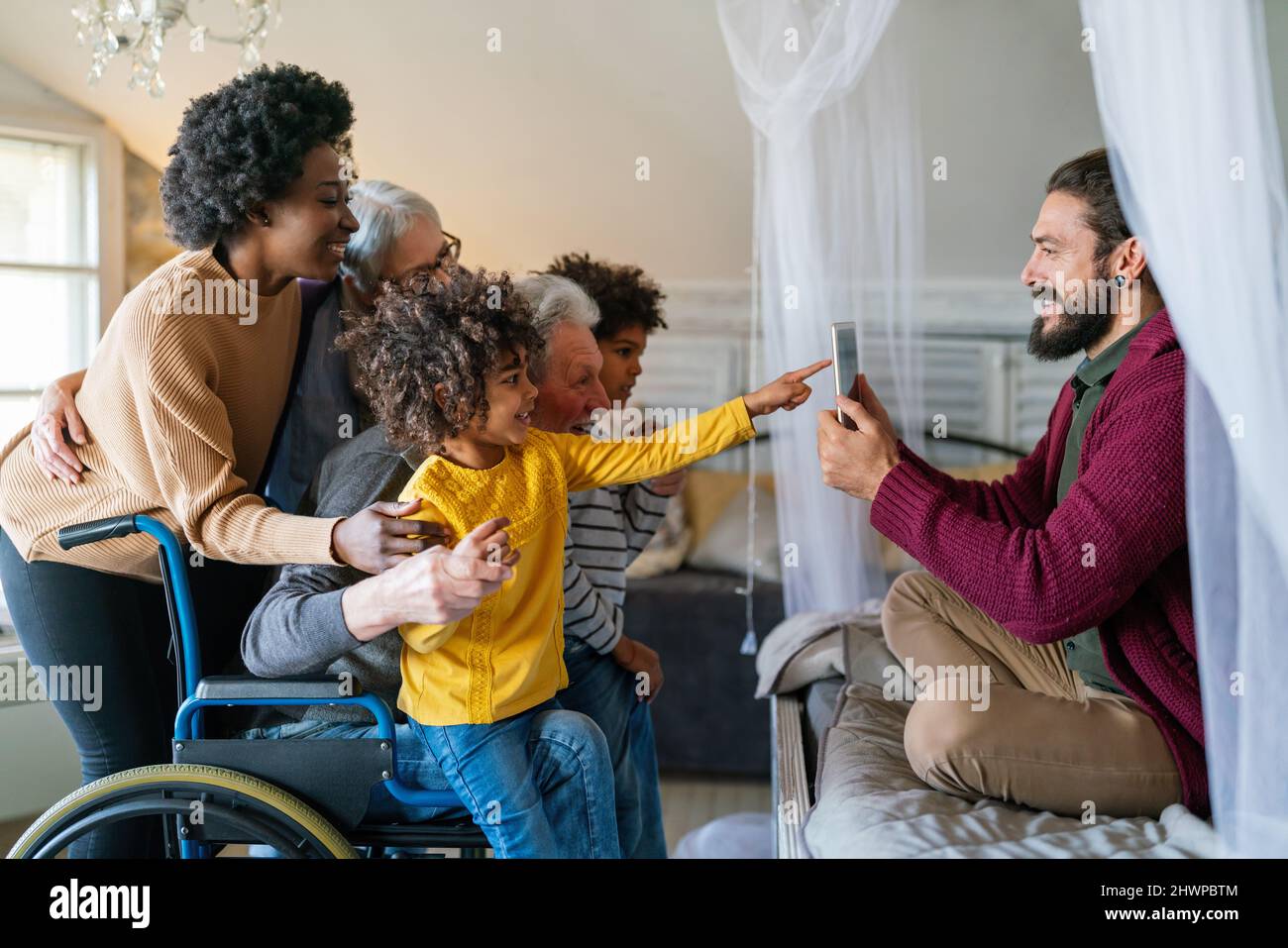 Portrait of multiethnic happy multi-generation family spending time ...